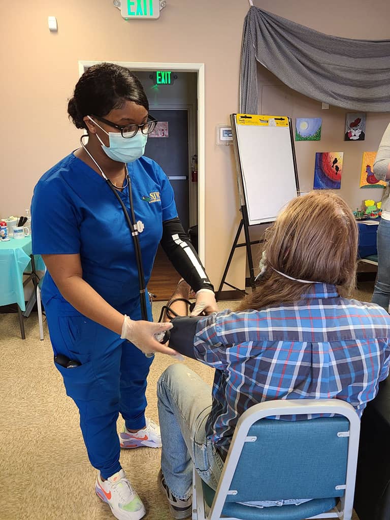 Clinical Medical Assisting Students Volunteer at Health Fair
